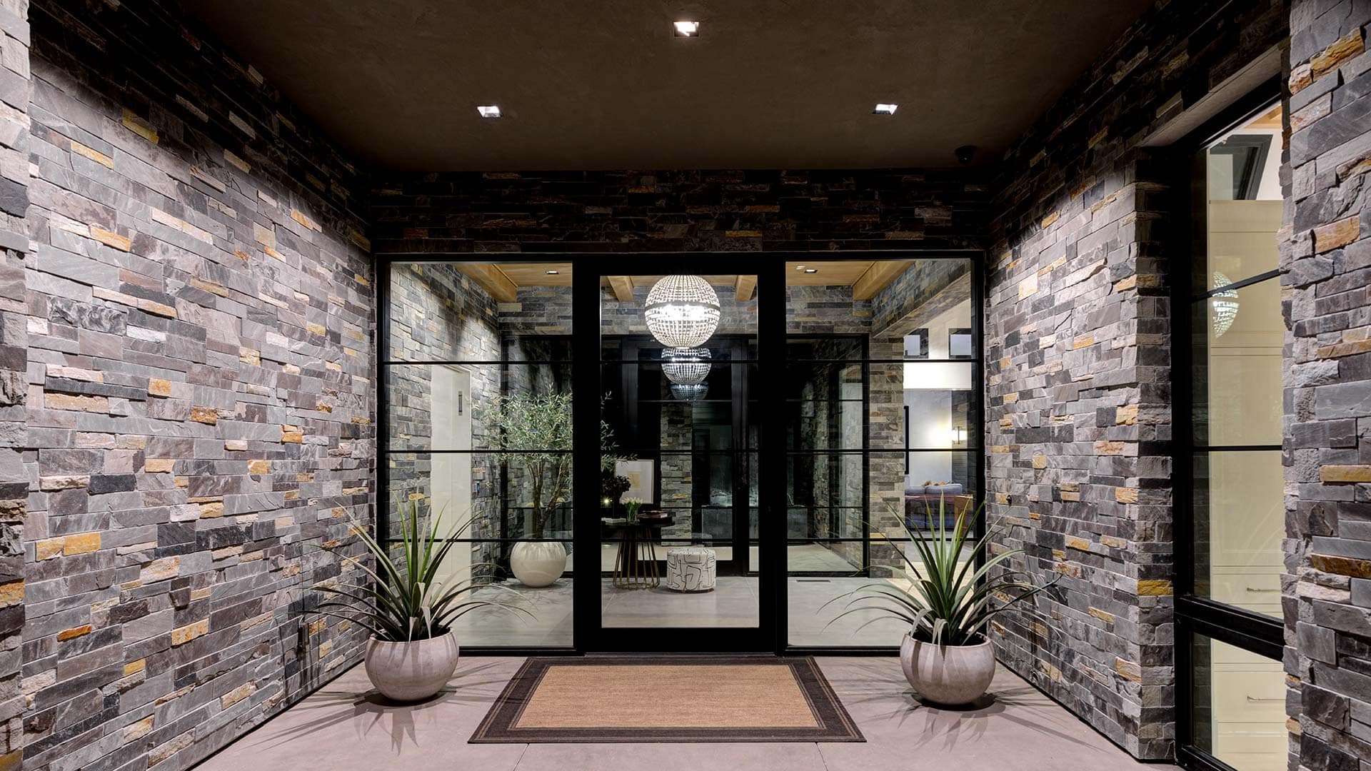 Brick Entry, Brick Exterior Design, Recessed LIghting, potted plants ...