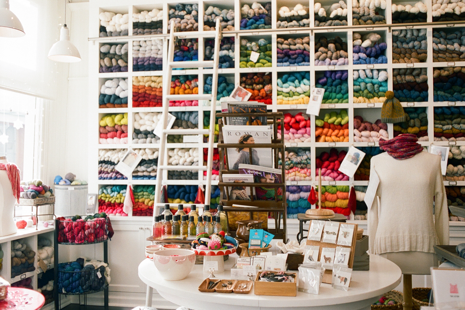 Cozy Retail Store Interior Featuring Bowl Pendant Lights Hanging from ...