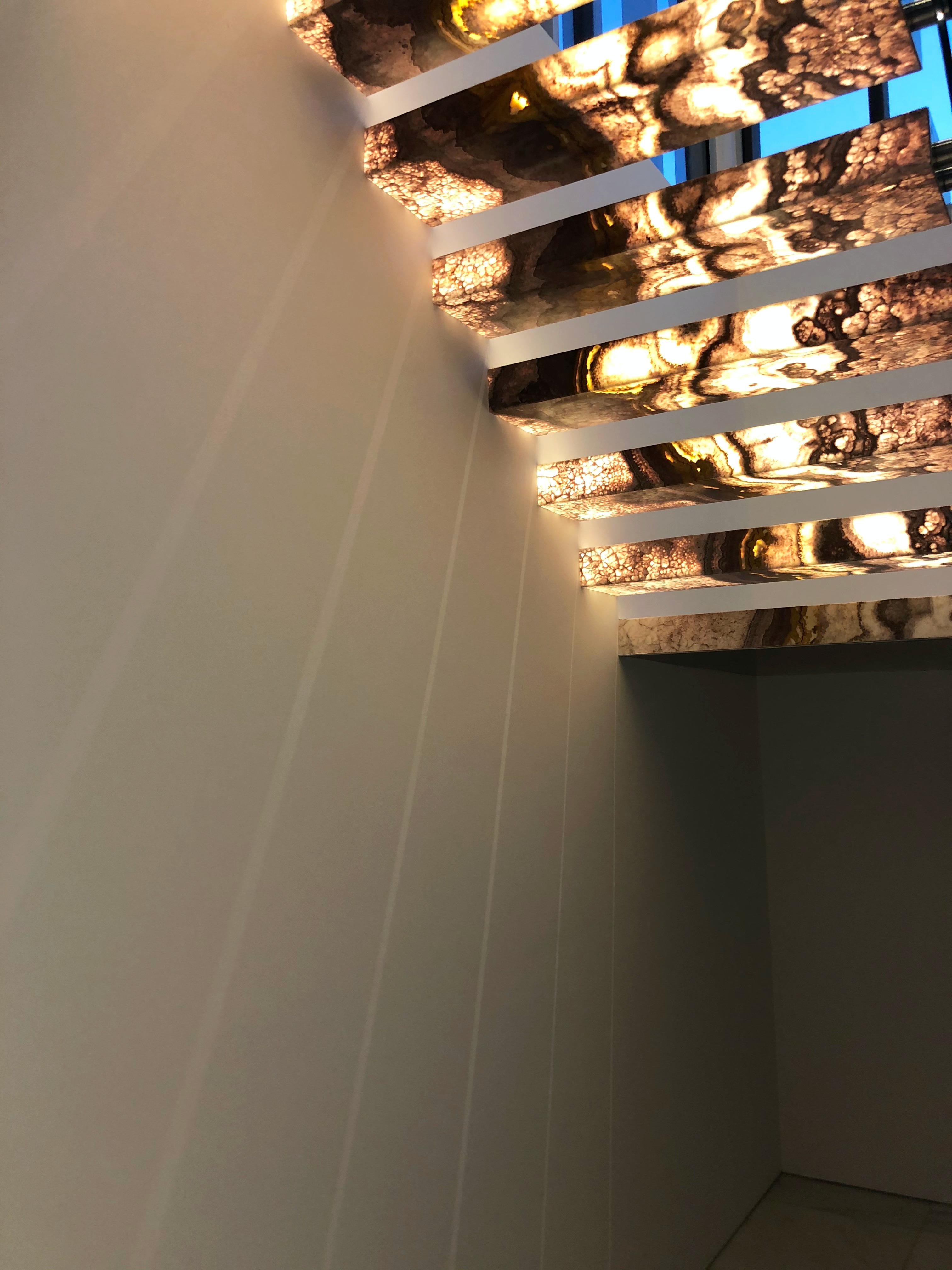 Floating Backlit Purple Onyx Staircase | GPI Design