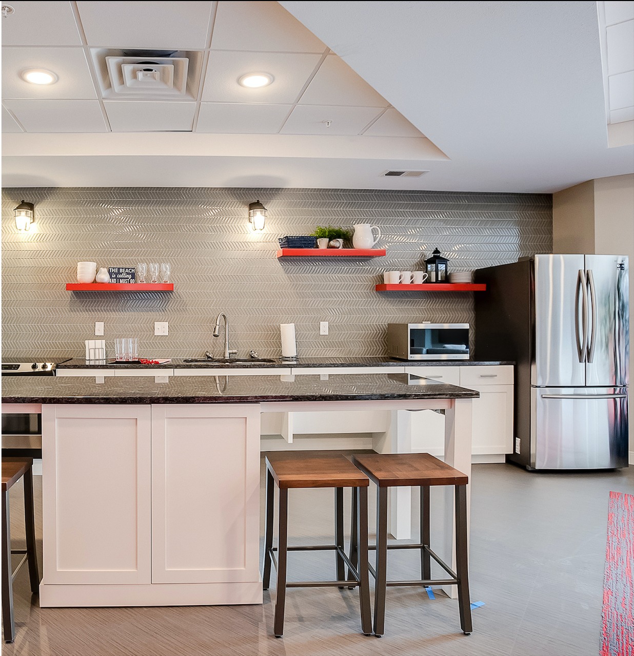 LAKE JONATHAN FLATS NRA lounge and kitchenette | Nelson-Rudie & Associates