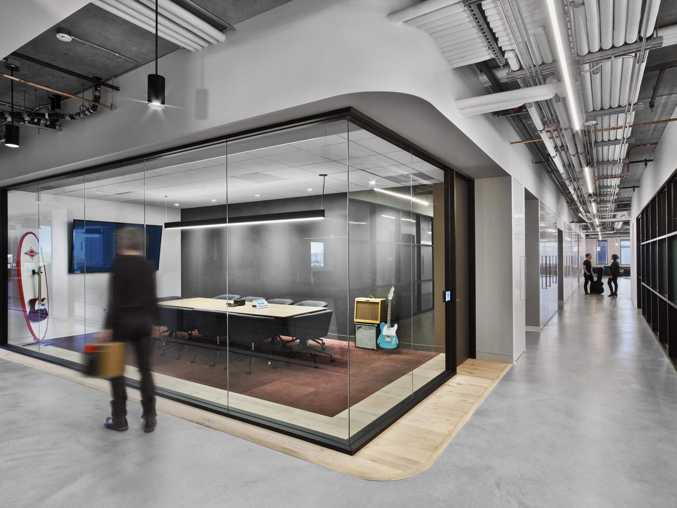 Office hallway with frameless glass walls | Rapt Studio