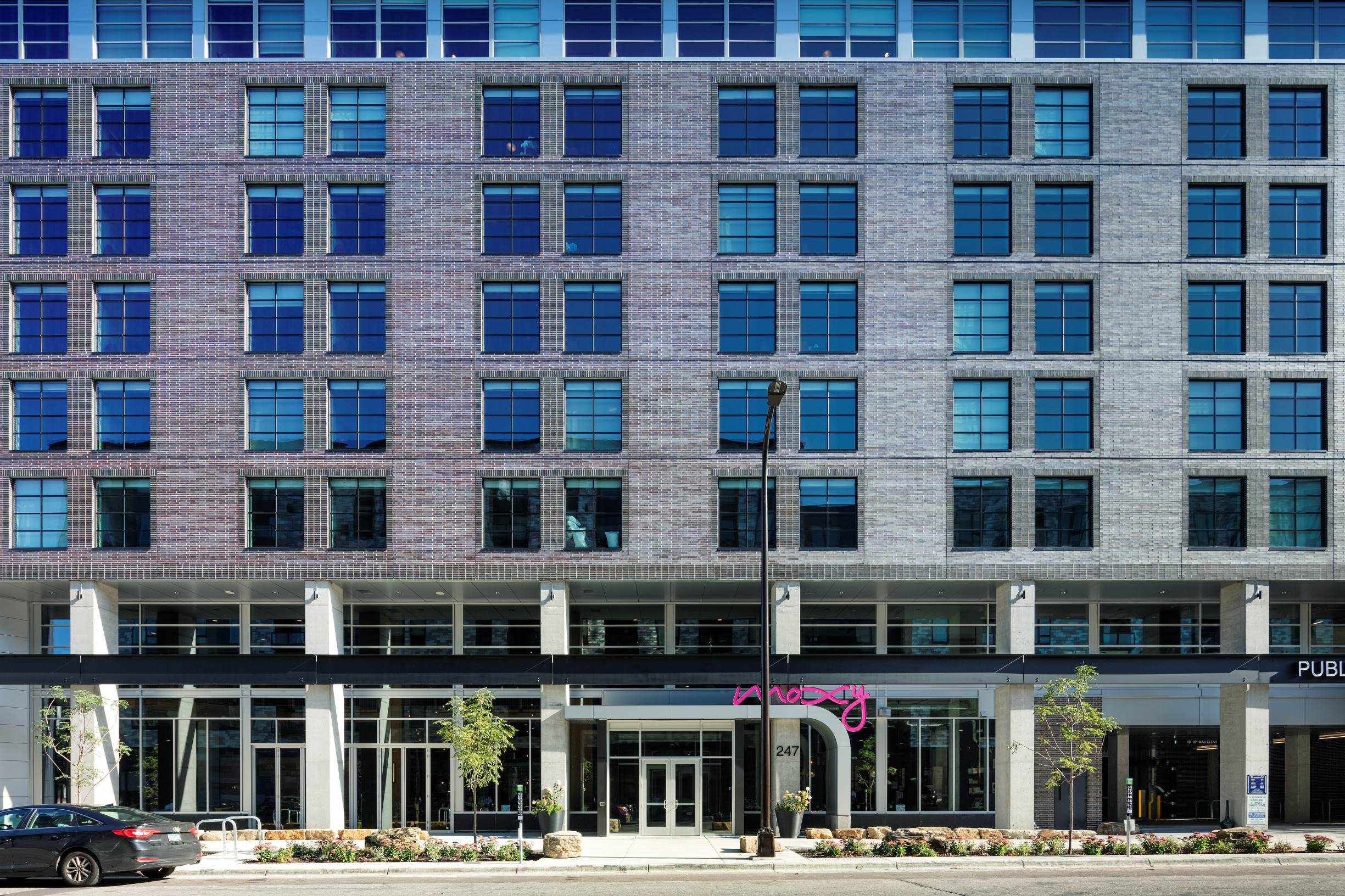 Pella Windows and Doors Moxy Apartment Building Exterior Brick and ...