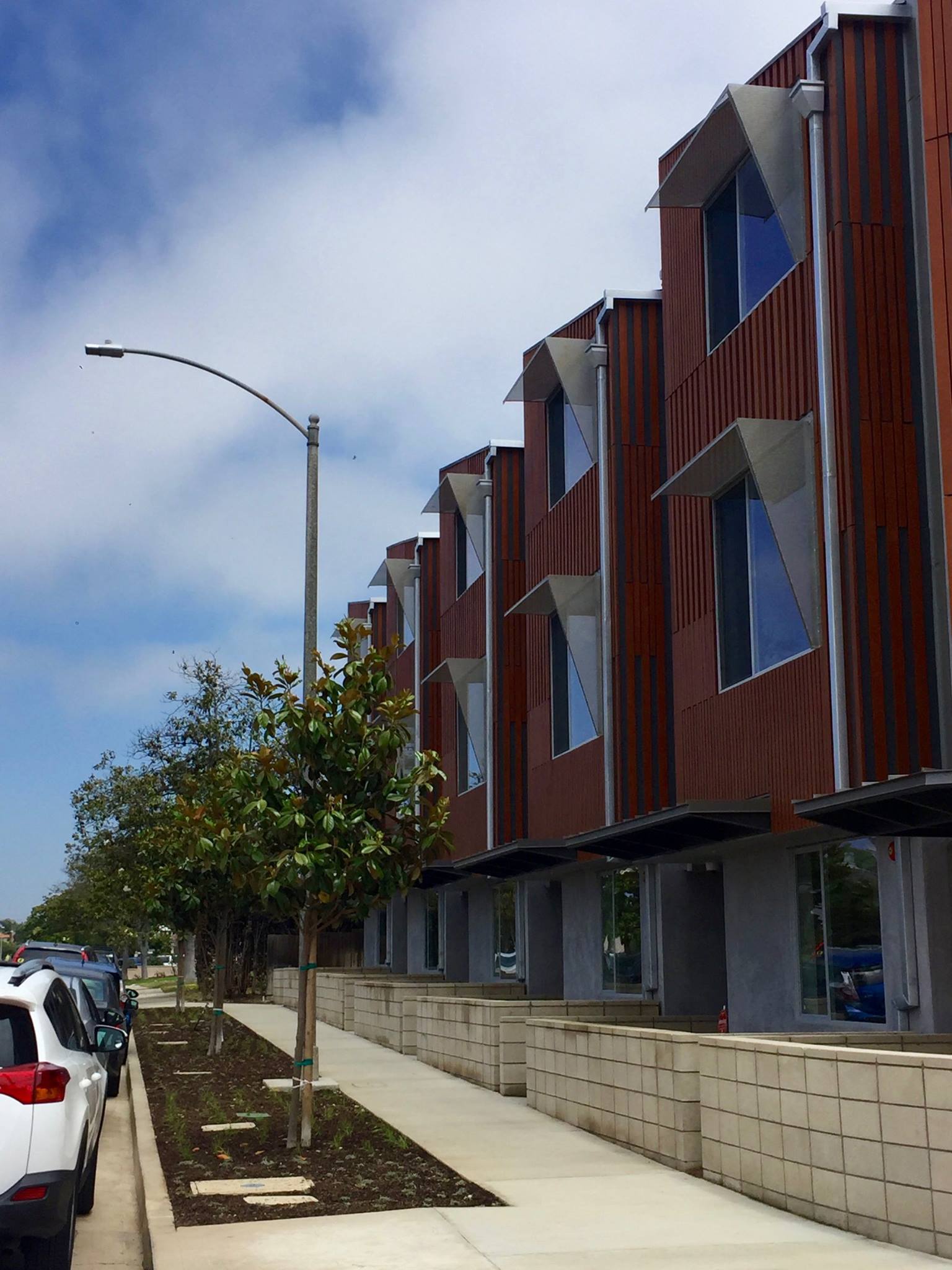 R D Architects Apartment Complex exterior sidewalk view | R&D Architects