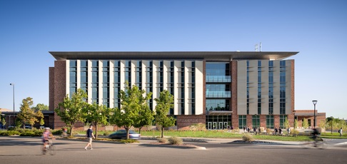 Shaded Main Education Building Entrance Outdoor Wood Seating | Gage ...